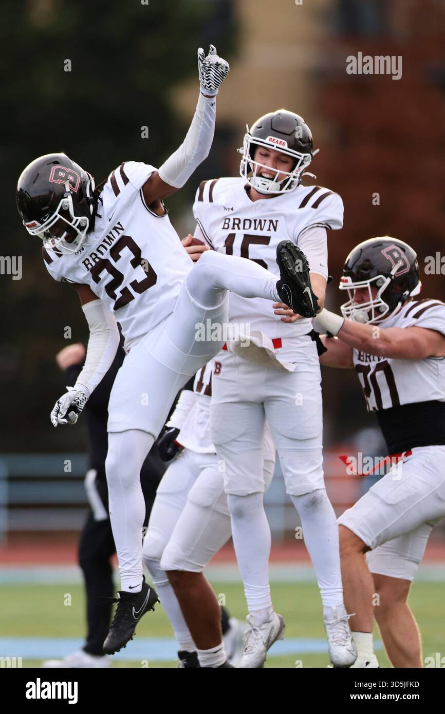 Brown quarterback James Murphy (15) and cornerback Camryn Williams ...