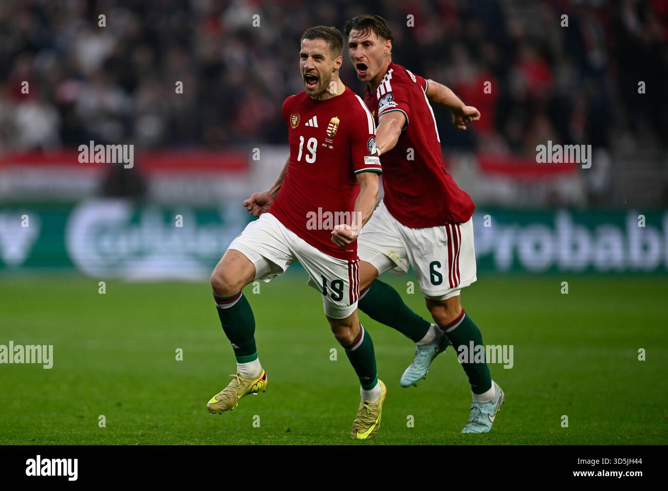 Hungary's Barnabas Varga, left, celebrates after scoring his side's ...