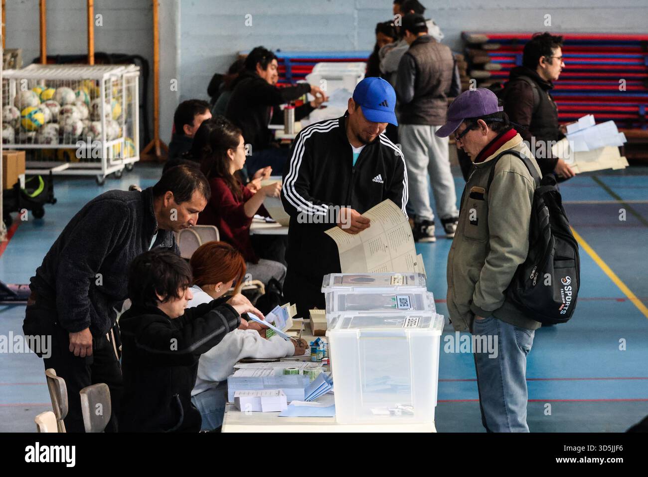 People seen casting their votes during the 2025 Chilean presidential ...