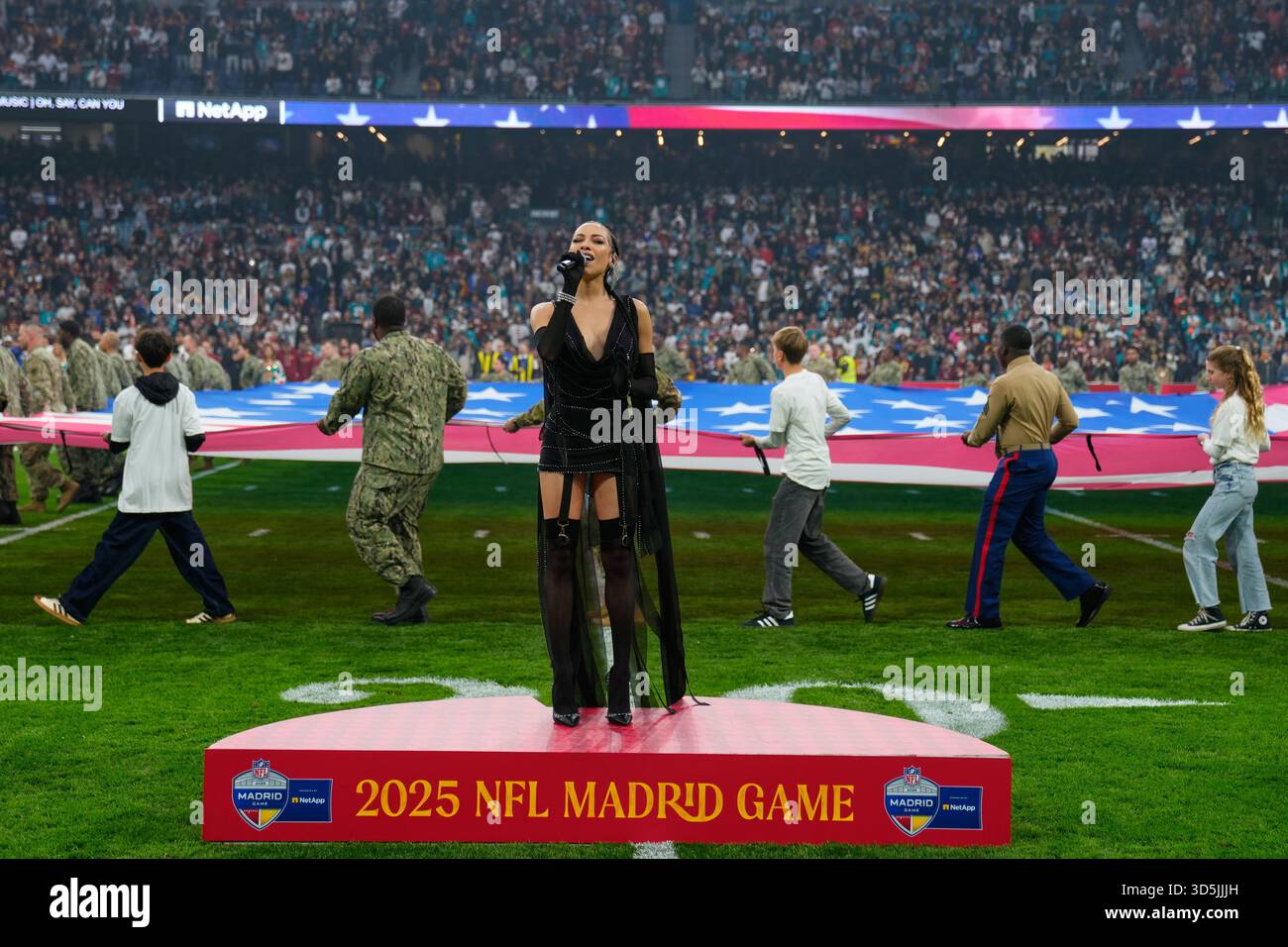 Karina Pasian sings the US national anthem before an NFL football game ...