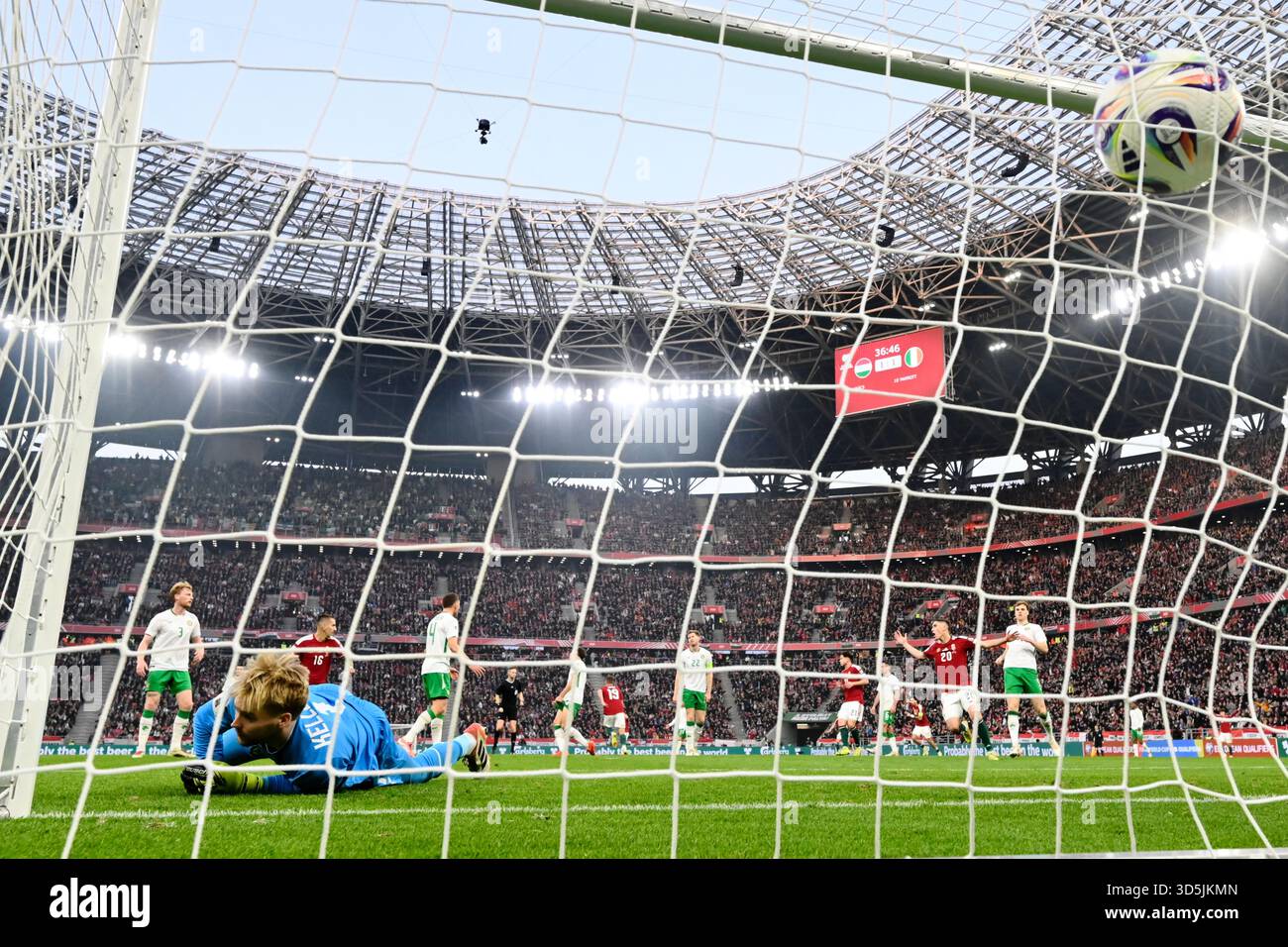 Ireland goalkeeper Caoimhin Kelleher fails to save a shot by Hungary's ...
