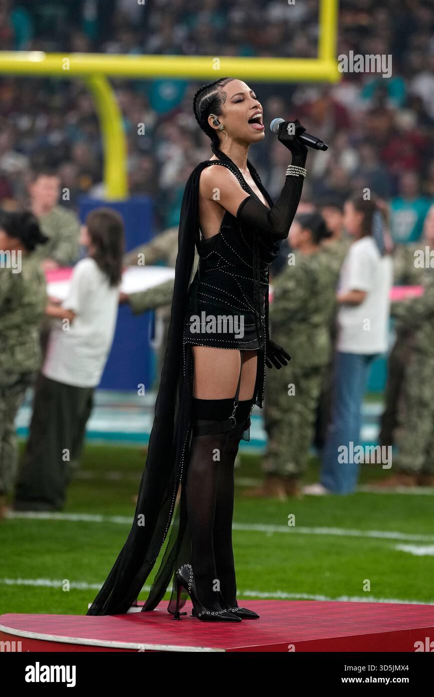 Karina Pasian sings the U.S. national anthem before an NFL football ...