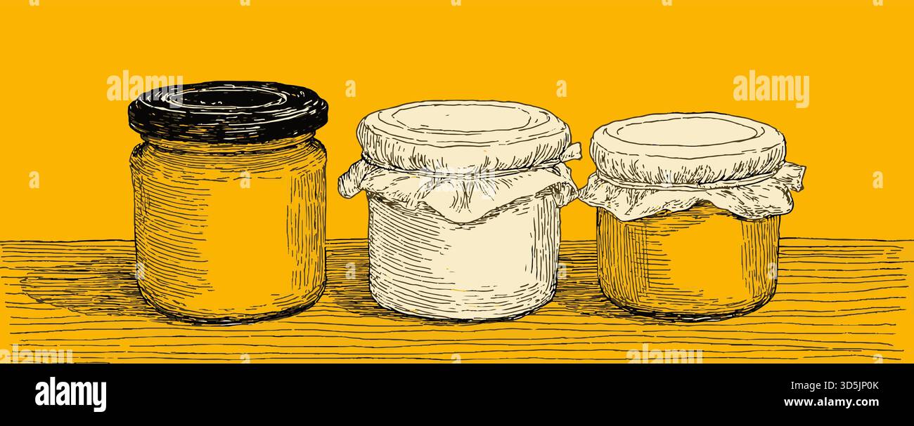 Three jars with lids on a table. The jars are different sizes and have ...