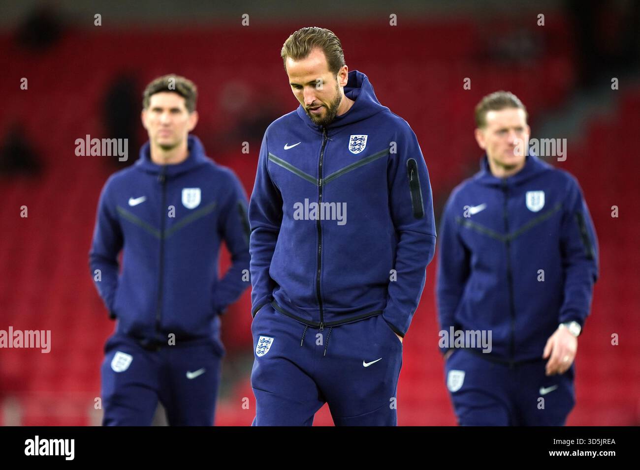 England's Harry Kane (centre) and team-mates inspect the pitch before ...
