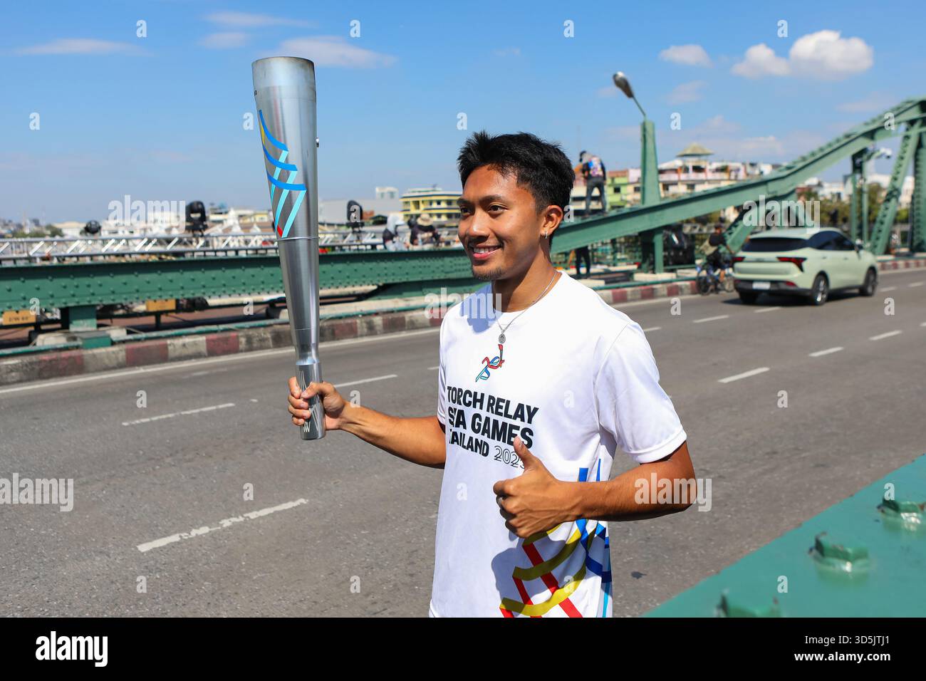 Puripol Boonson, a Thai national runner, of the 33rd SEA Games Torch ...