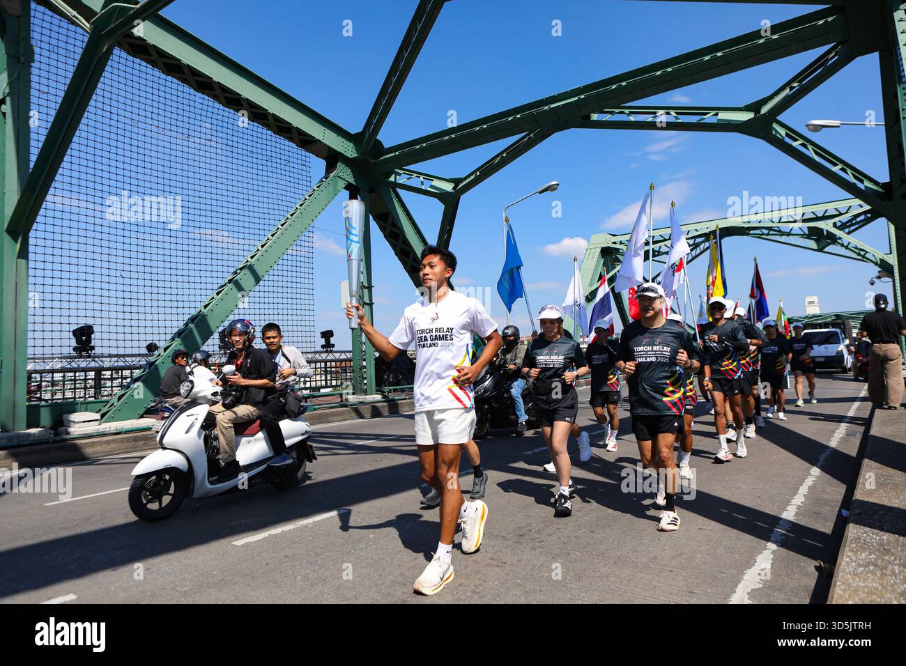 Puripol Boonson, a Thai national runner, of the 33rd SEA Games Torch ...