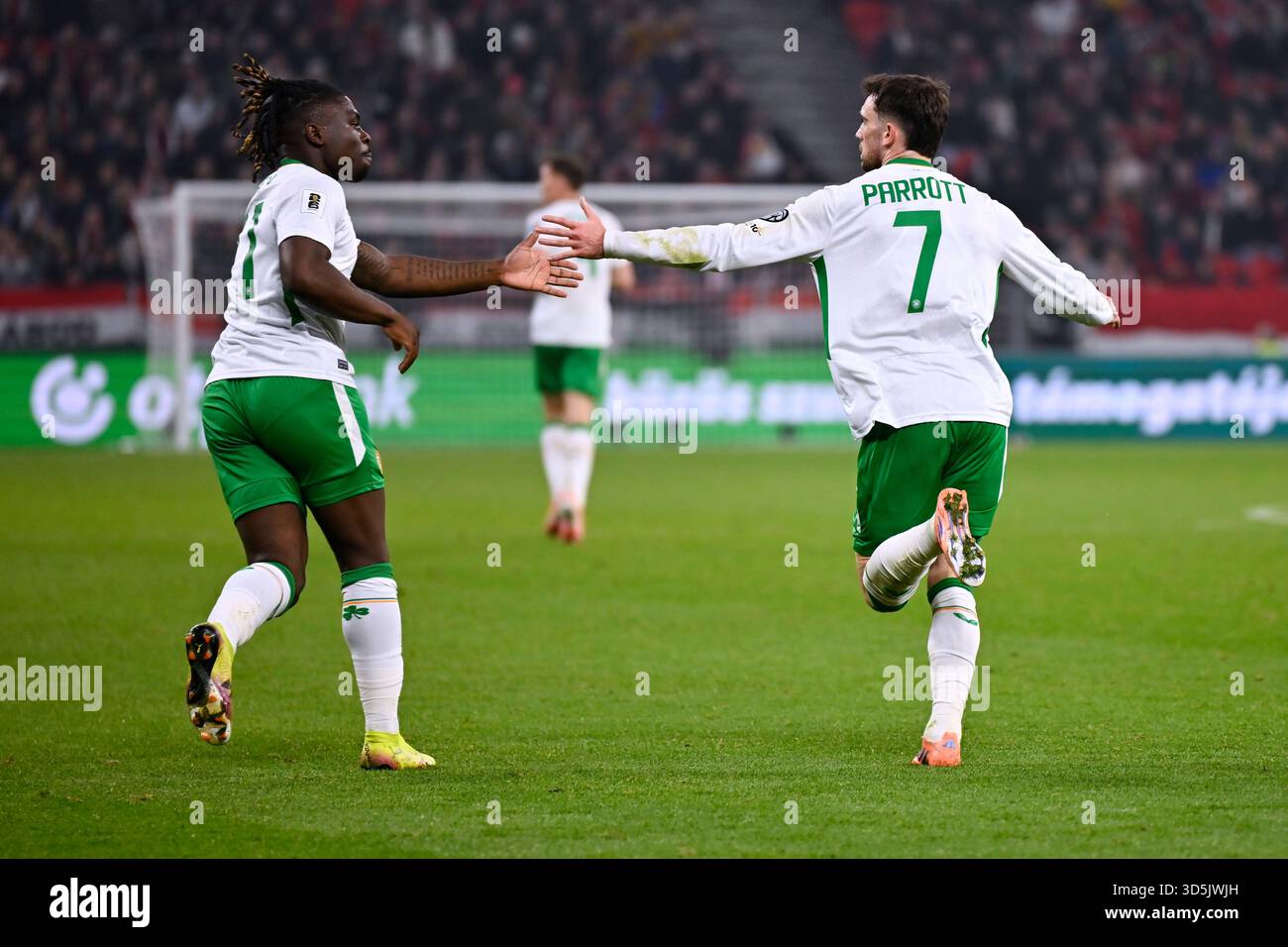 Ireland's Troy Parrott, right, celebrates after scoring his side's ...