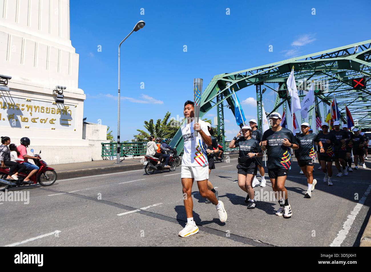Puripol Boonson, a Thai national runner, of the 33rd SEA Games Torch ...