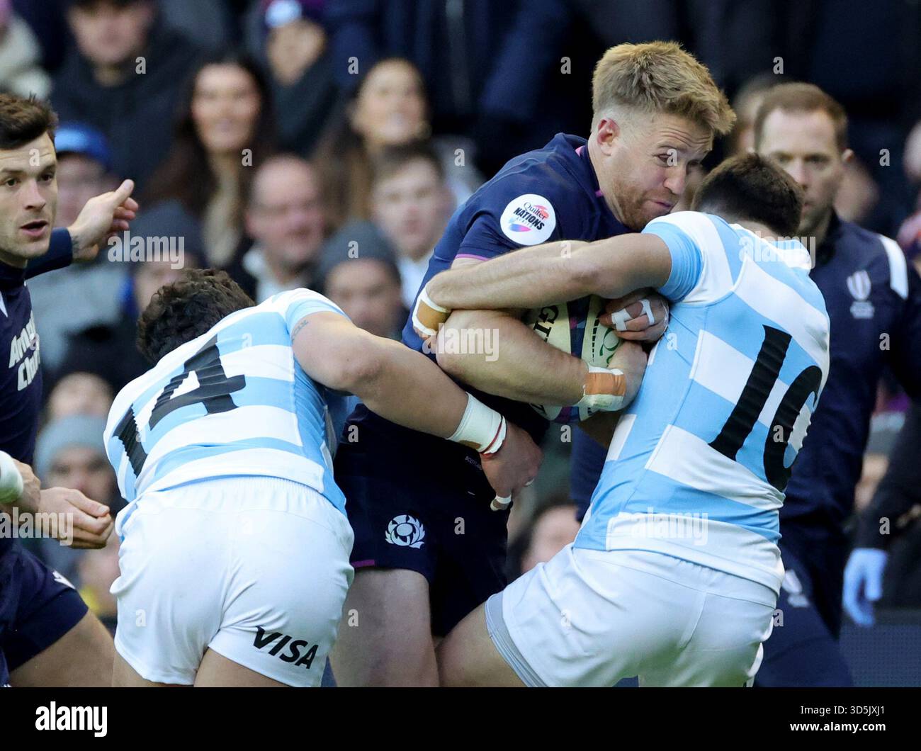 Scotland's Kyle Steyn (centre) is tackled by Argentina's Geronimo ...