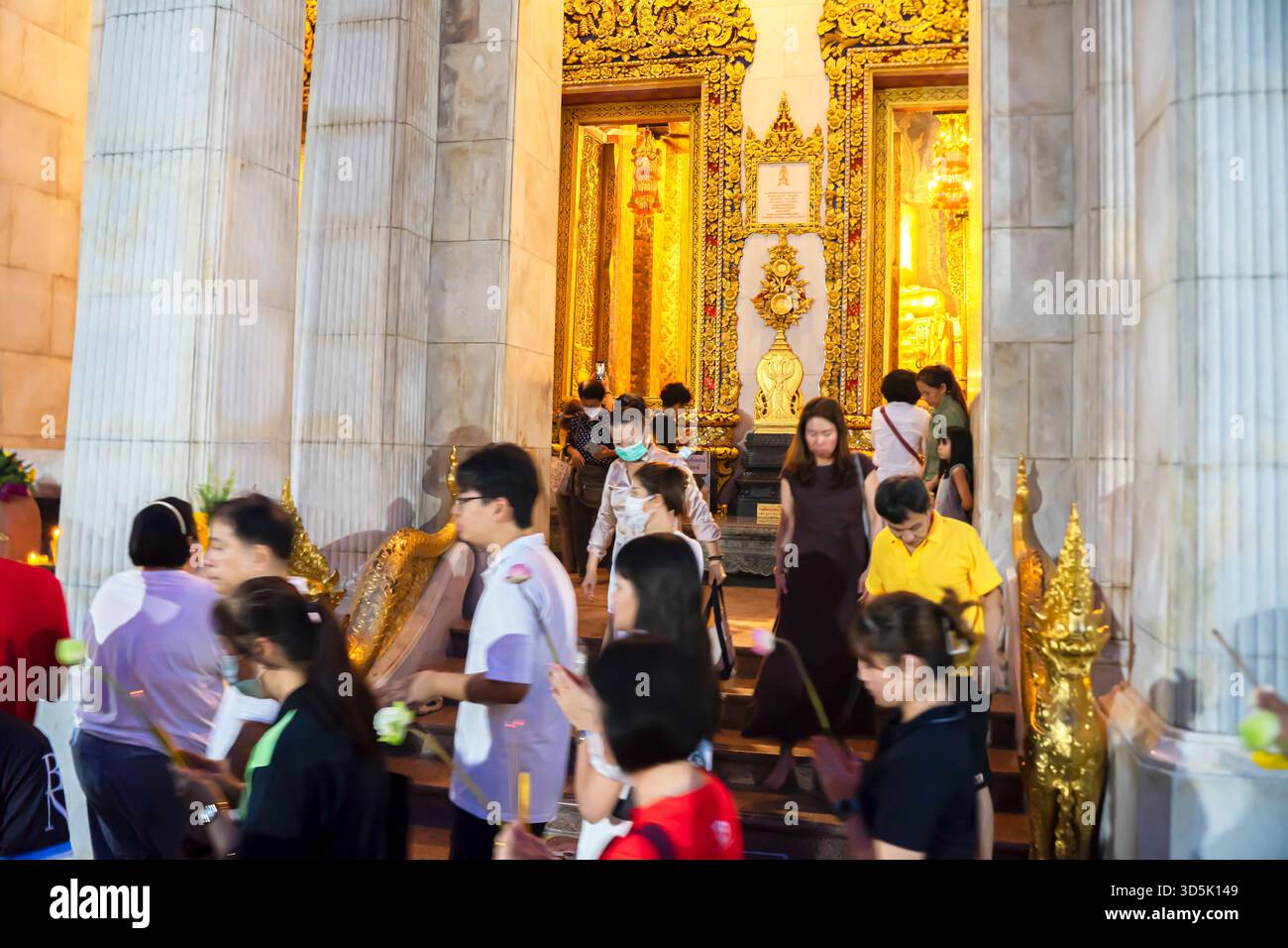 Visitors walk around the temple on Visakha Bucha Day, religious ...