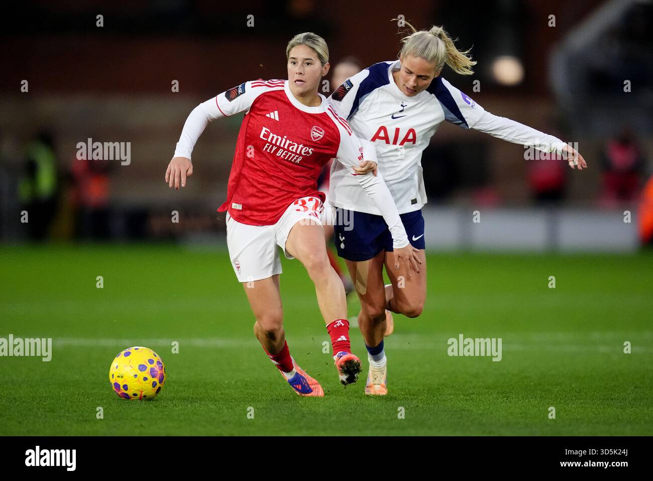 Arsenal's Kyra Cooney-Cross (left) and Tottenham Hotspur's Olivia Holdt ...