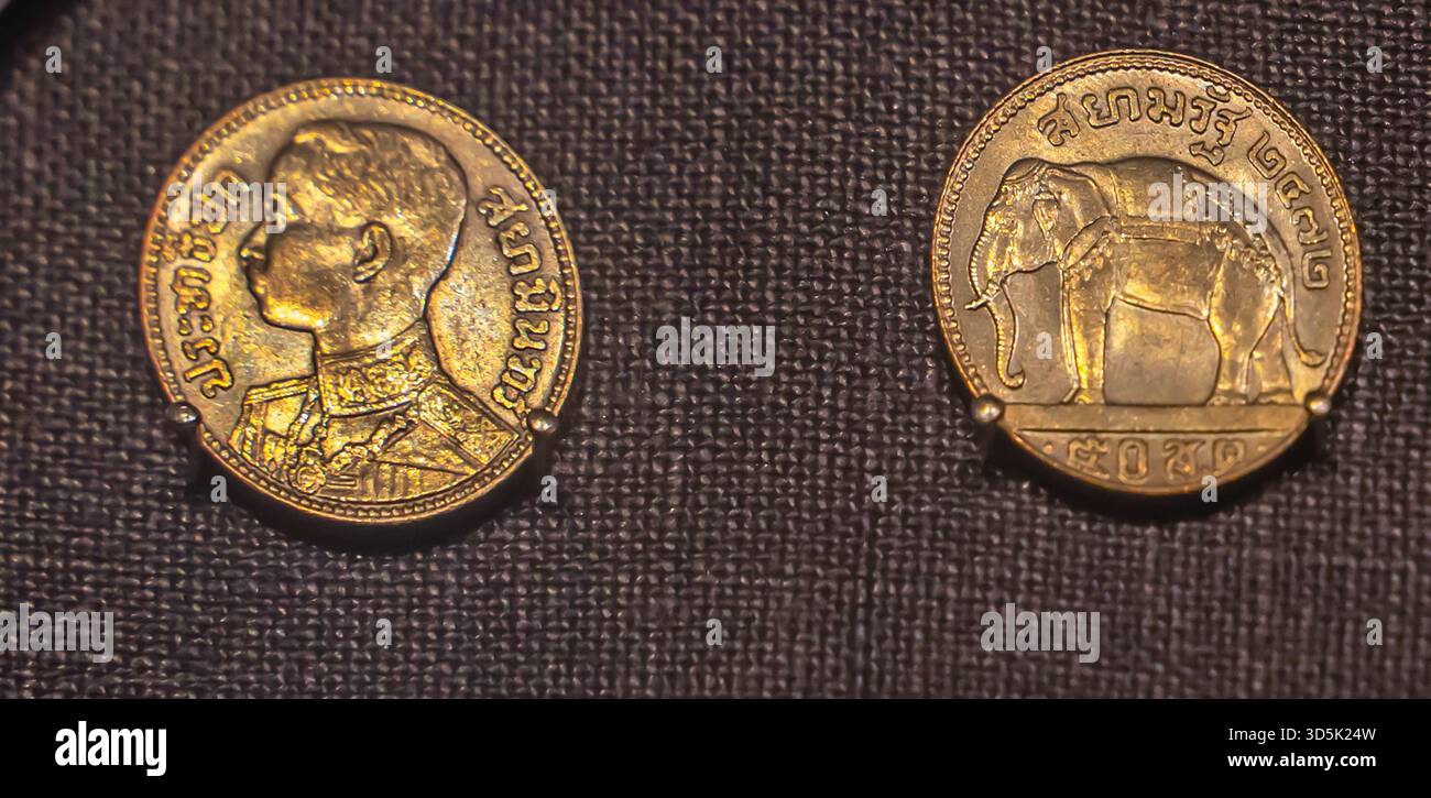 Thai 25-satang coins from the reign of King Rama VII, minted in the ...