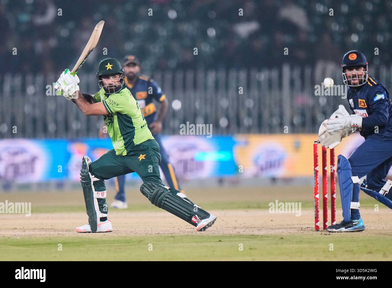 Pakistan's Hussain Talat, left, plays a shot as Sri Lanka's Kusal ...