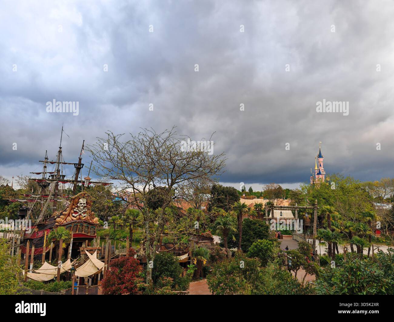 Pirate ship and castle view under dramatic cloudy sky Stock Photo - Alamy