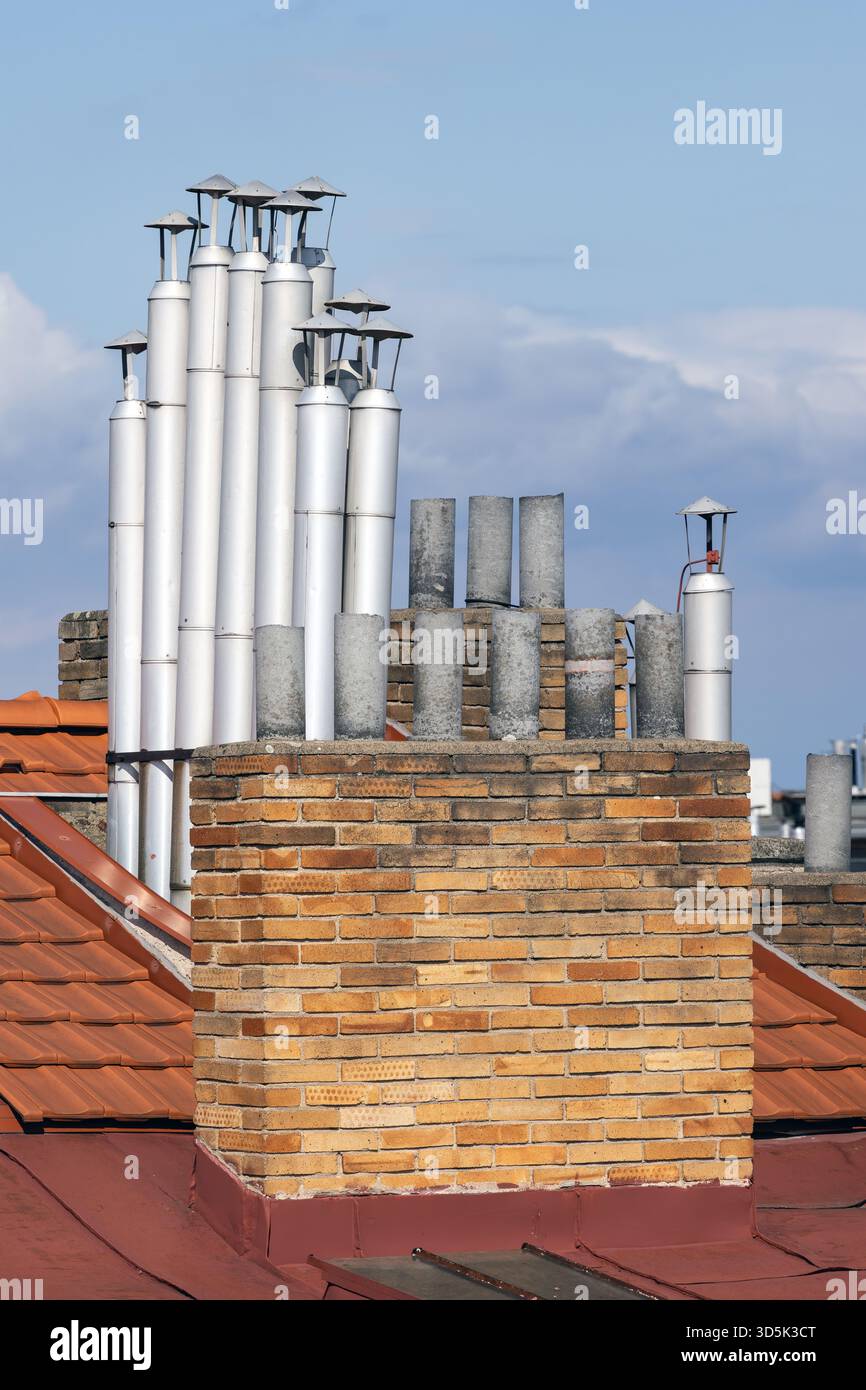 Exhaust pipes and chimneys on an apartment building Stock Photo - Alamy