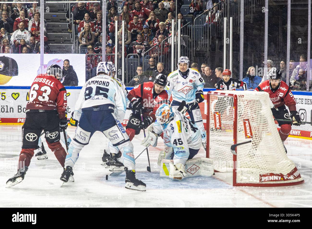 Jussi Olkinuora (Dresden Ice Lions, #45) clears in front of Patrick ...