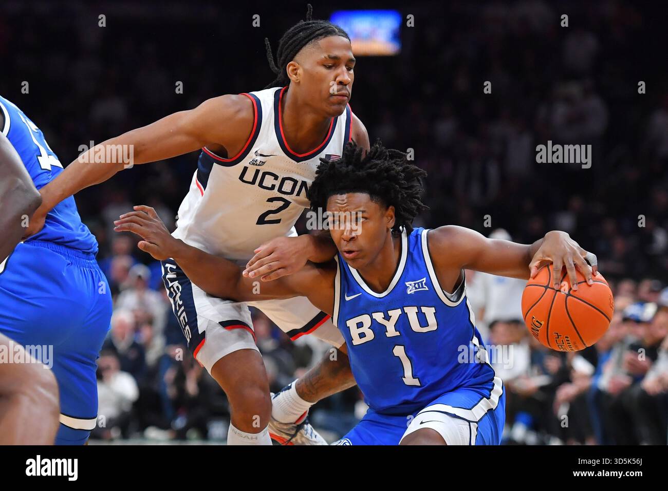 BYU guard Robert Wright III (1) tries to drive with the ball as UConn ...