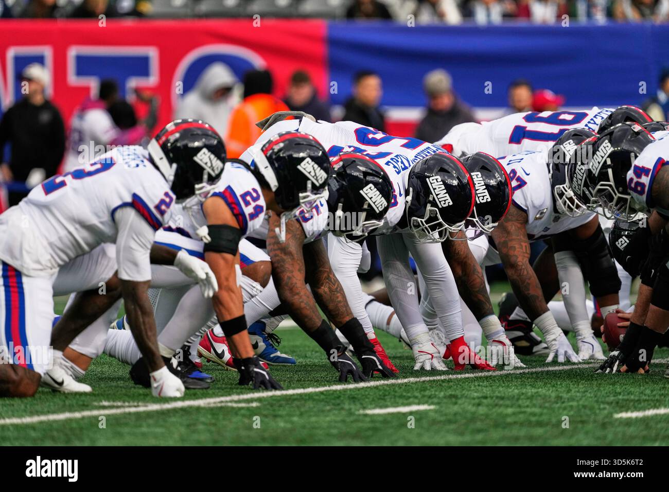 New York Giants players line up before an NFL football game against the ...