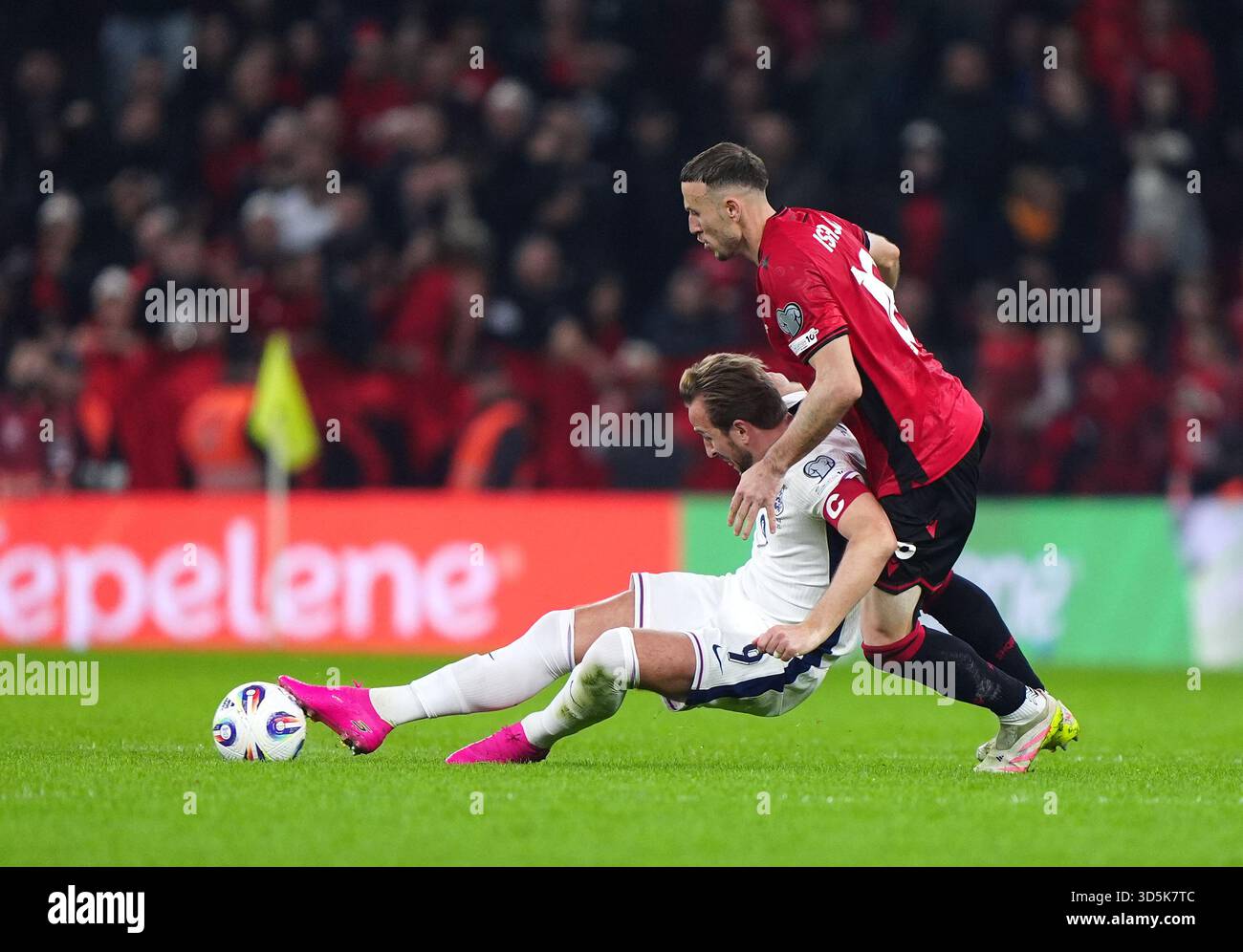 England's Jude Bellingham (left) and Albania's Ardian Ismajli battle ...