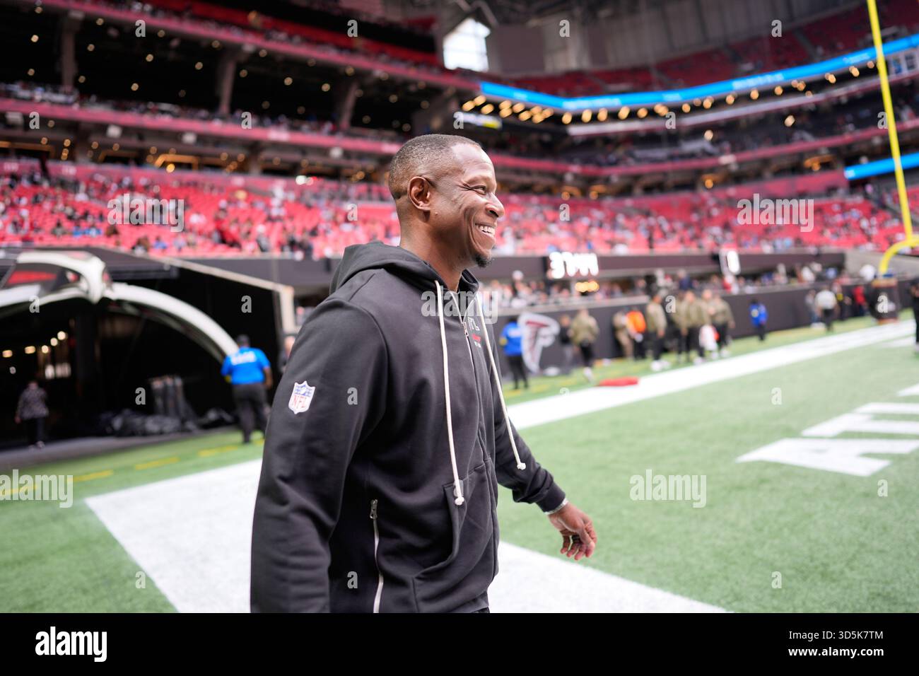 Atlanta Falcons head coach Raheem Morris laughs on the field before an ...