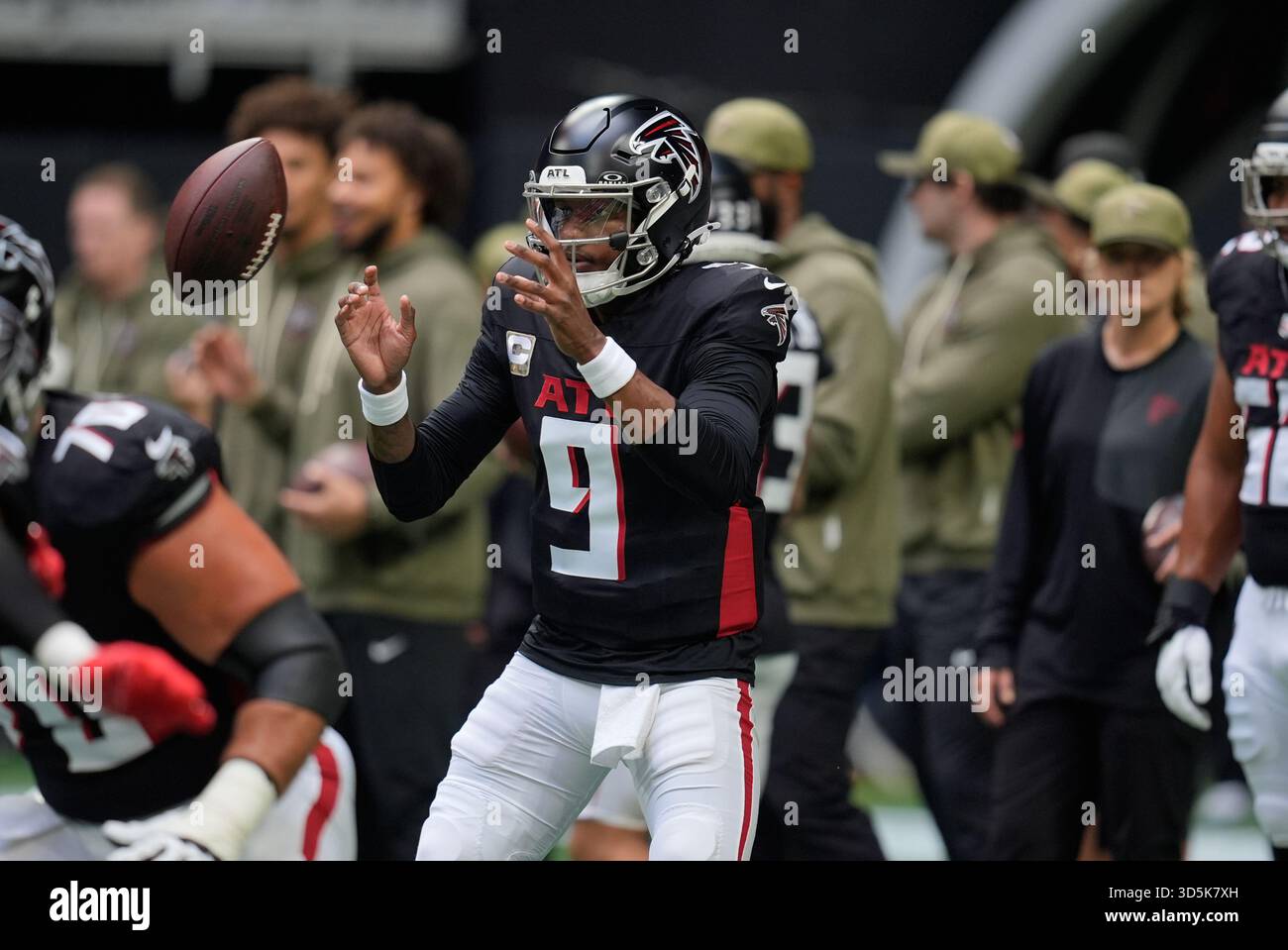 Atlanta Falcons quarterback Michael Penix Jr. (9) warms up before an ...