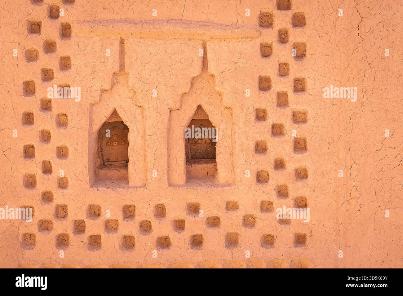Detail of a wall with symmetrical Berber patterns in Ait Ben Haddou ...