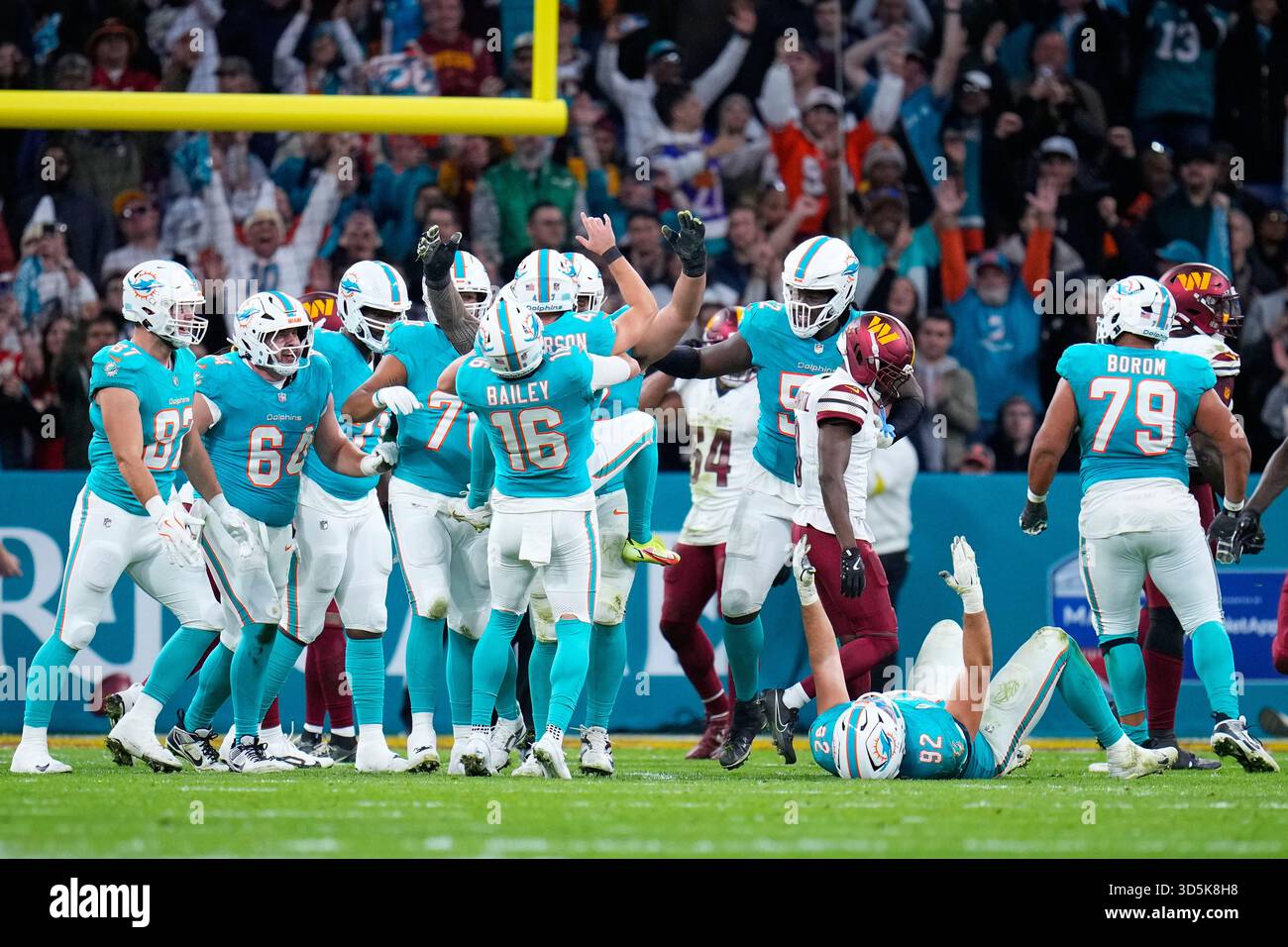 Miami Dolphins players celebrate with place kicker Riley Patterson (47 ...