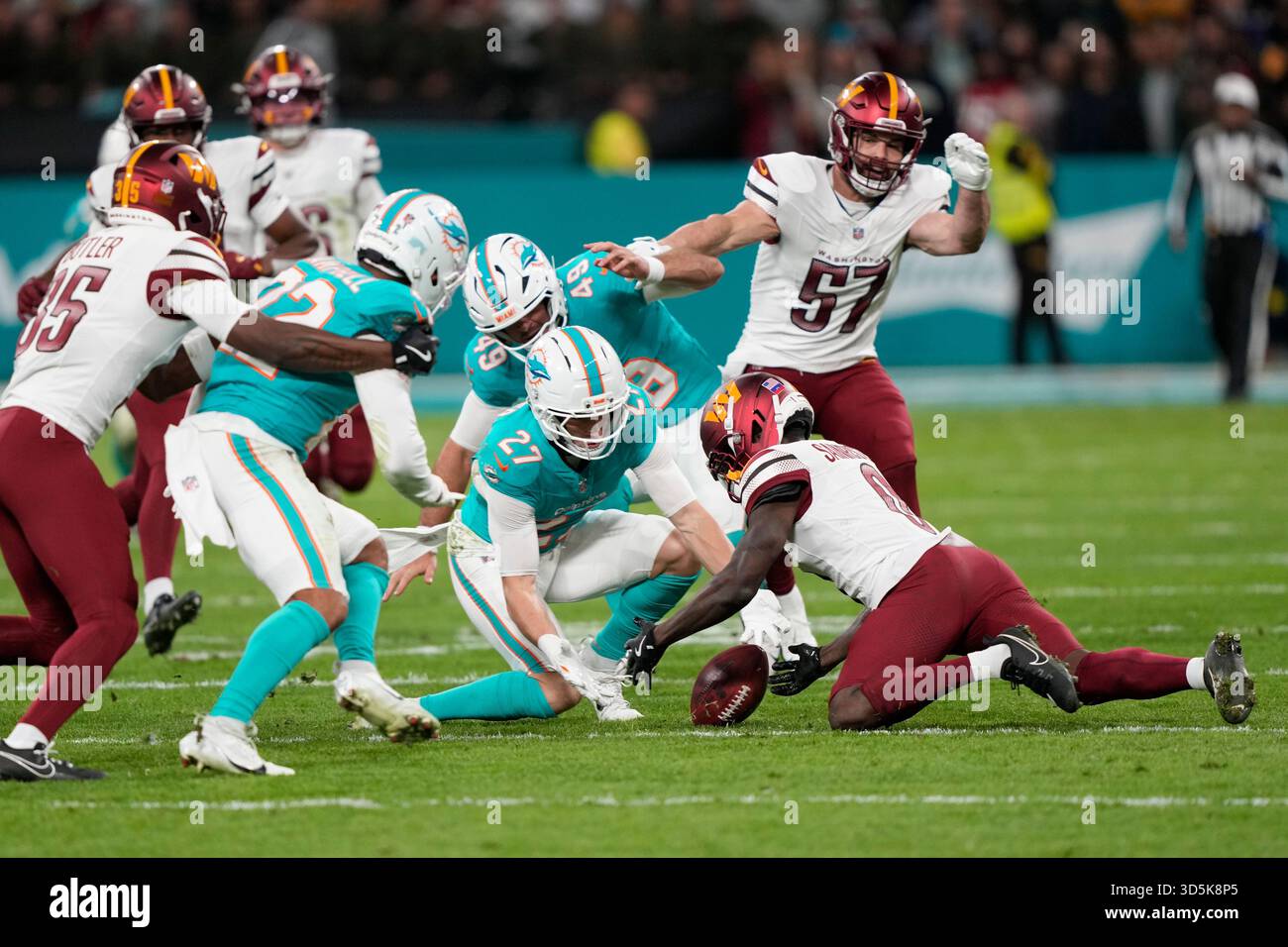 Miami Dolphins' Ethan Bonner (27) recovers a fumbled punt by Washington ...