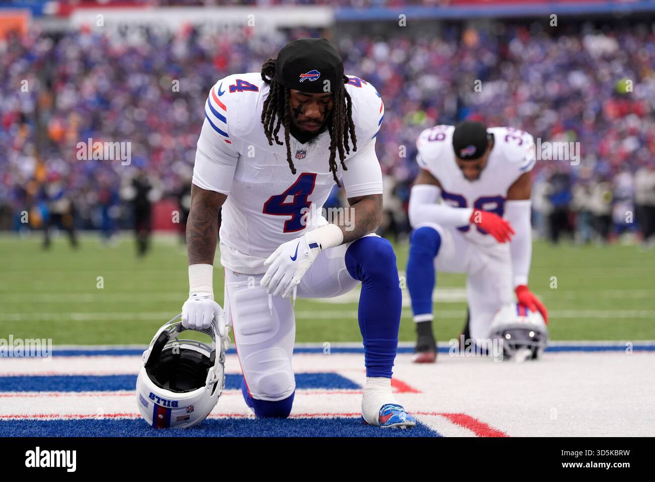 Buffalo Bills running back James Cook III (4) prays before the first ...