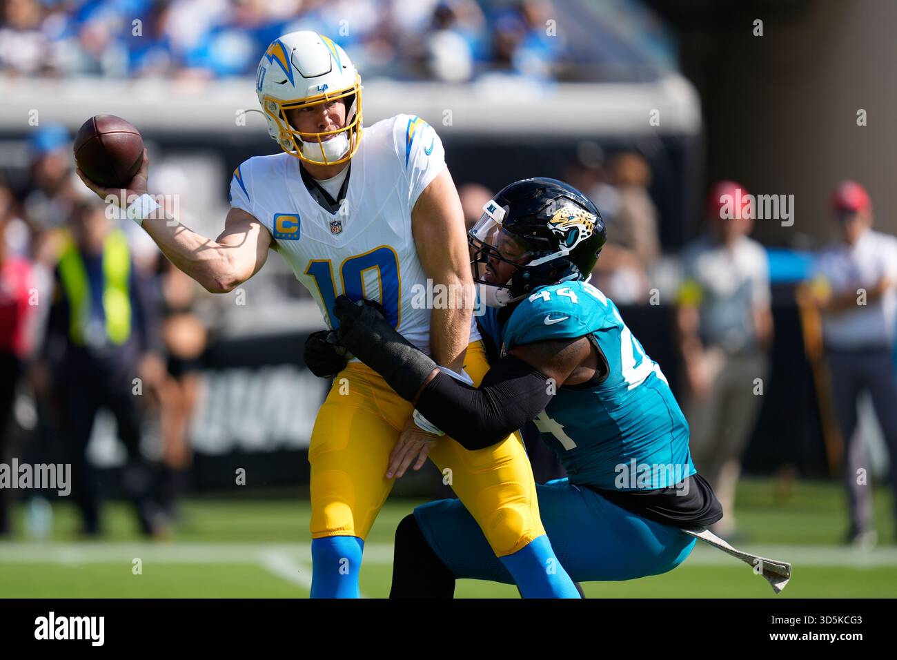 Los Angeles Chargers quarterback Justin Herbert (10) is tackled by ...