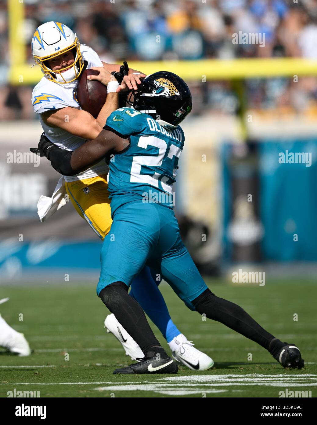 Los Angeles Chargers quarterback Justin Herbert (10) is tackled by ...
