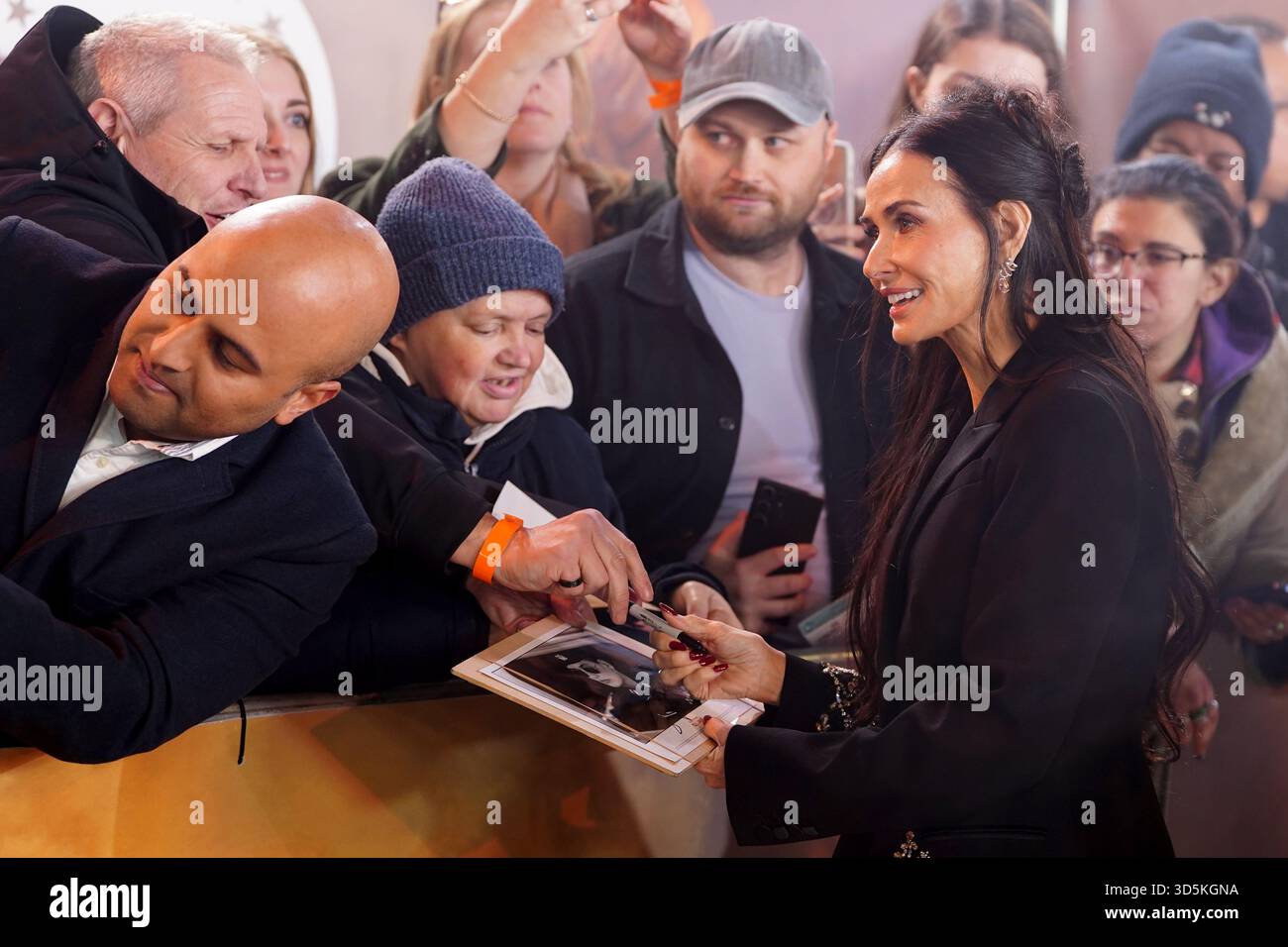 Demi Moore signs autographs for fans as she attends the Landman season ...