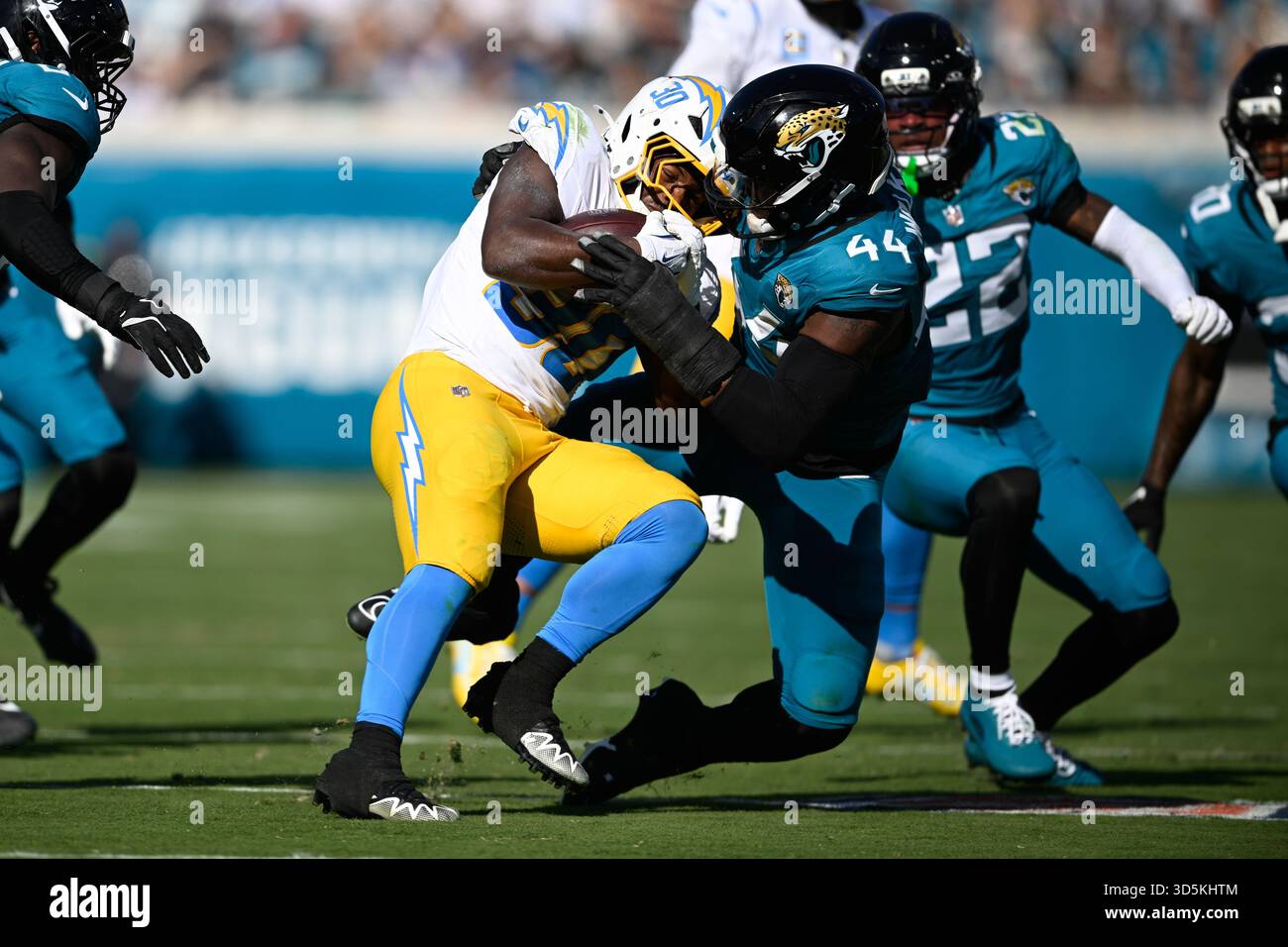 Los Angeles Chargers running back Kimani Vidal (30) is tackled by ...