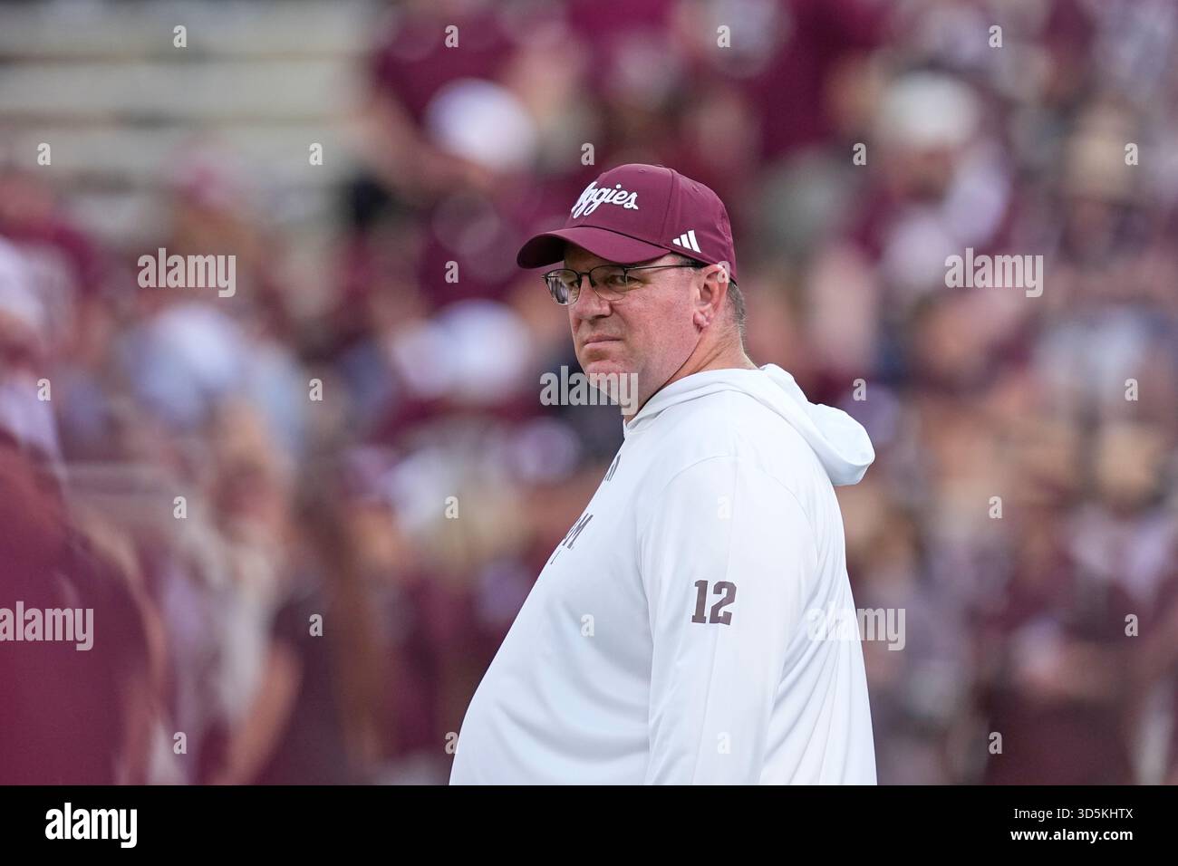Texas A&M head coach Mike Elko watches players stretch before an NCAA ...