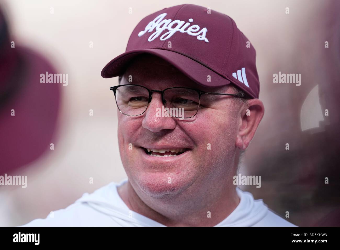 Texas A&M head coach Mike Elko watches players stretch before an NCAA ...