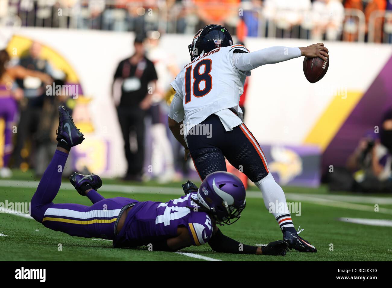 Chicago Bears quarterback Caleb Williams (18) avoids being tackled by ...