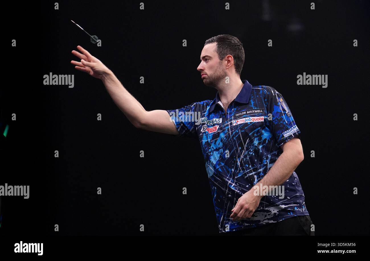 Luke Humphries in action during the final against Luke Littler, at the ...