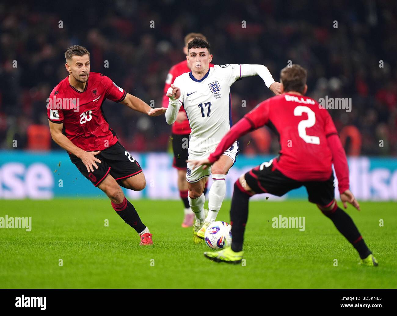 England's Phil Foden (centre) battles for the ball with Albania's Ylber ...