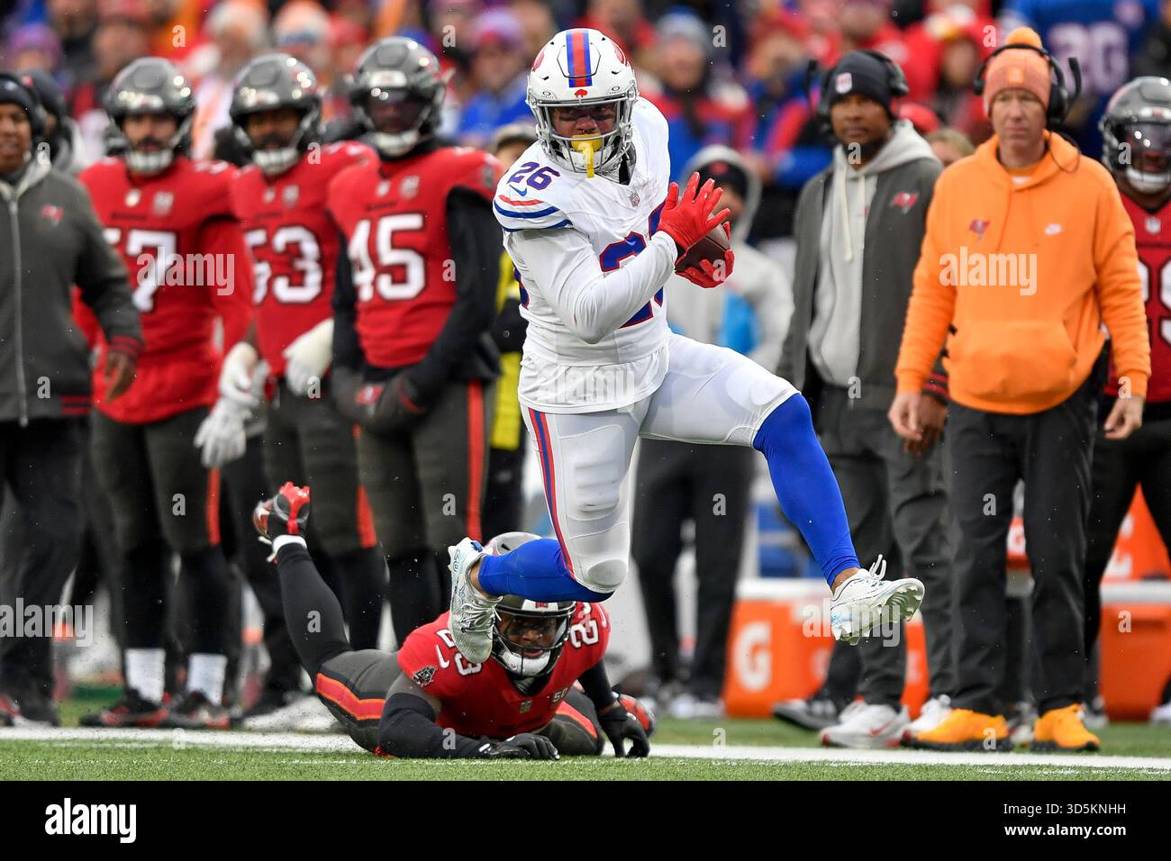 Buffalo Bills running back Ty Johnson, right, breaks a tackle by Tampa ...