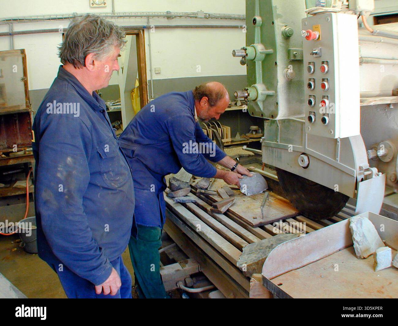 a stonemason working with stone, craft for construction and ...