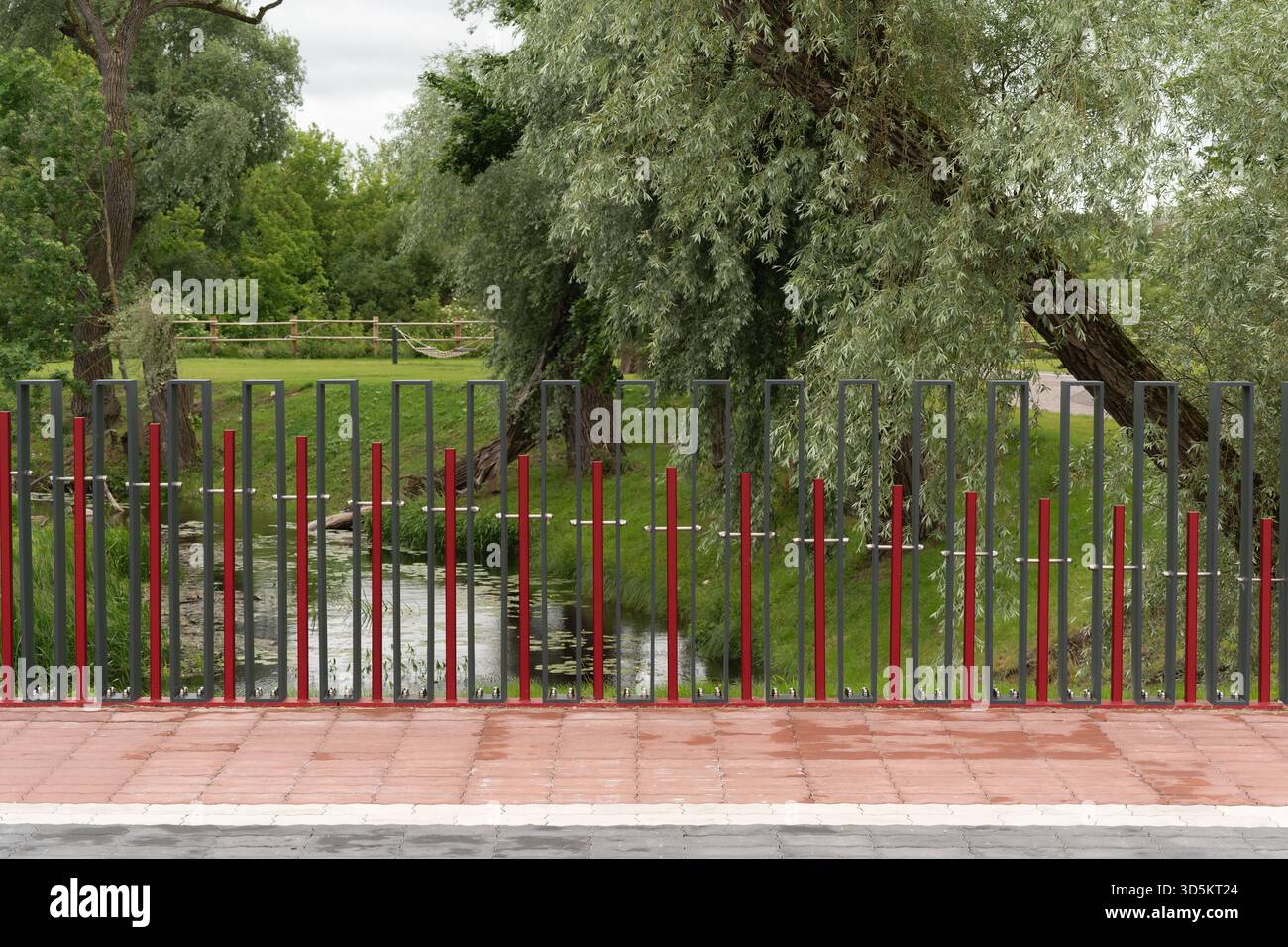Duke Jacob's Canal in Jelgava, Latvia, with a modern arch bridge and ...