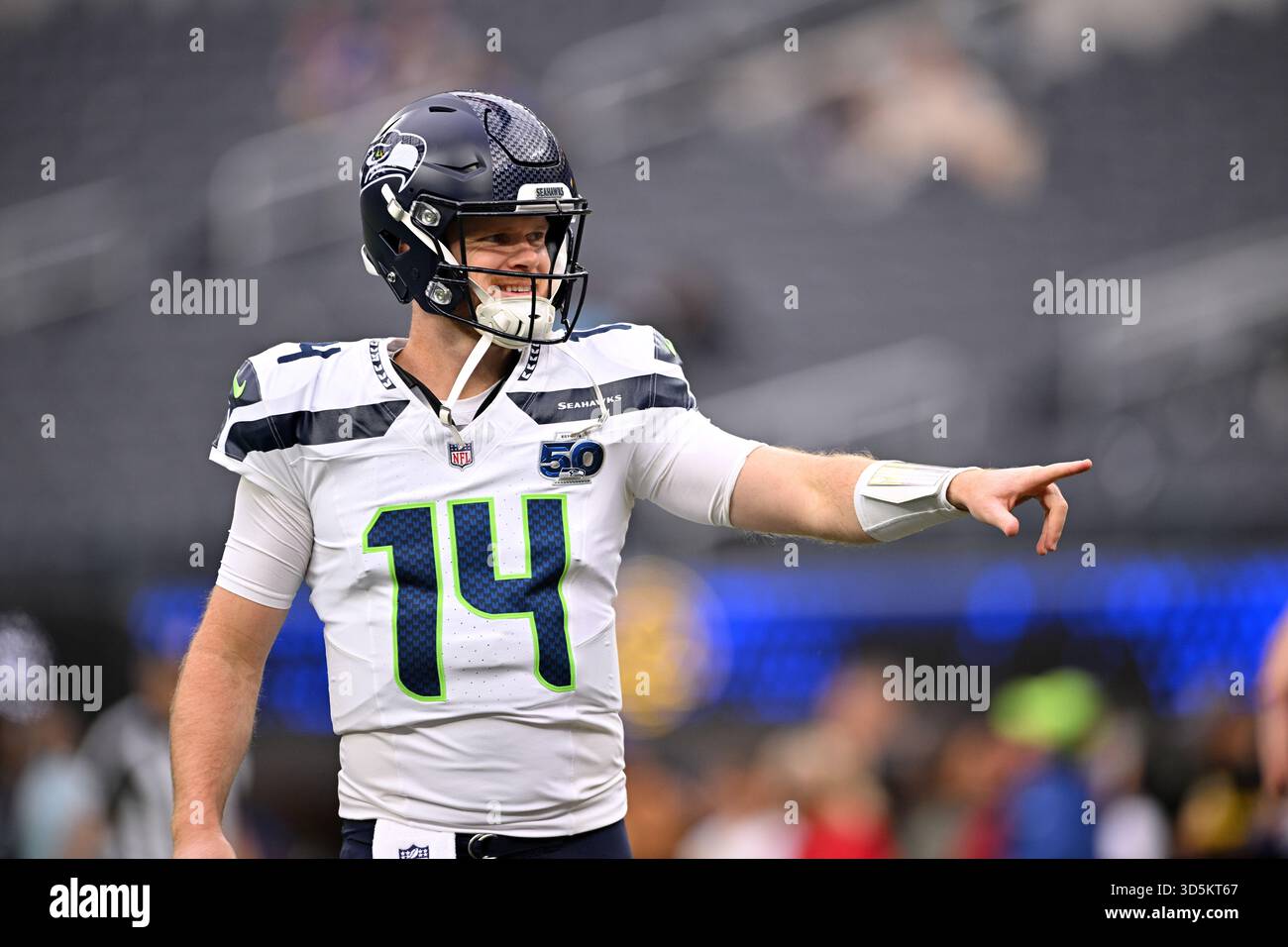 Seattle Seahawks quarterback Sam Darnold gestures as he warms up prior ...