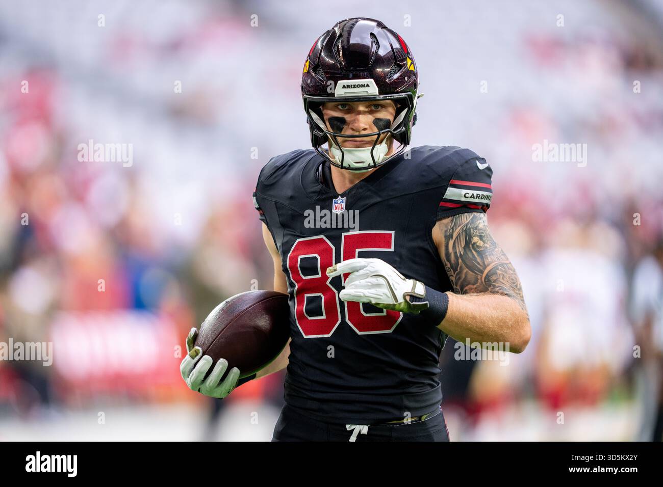 Arizona Cardinals tight end Trey McBride (85) warms up before an NFL ...