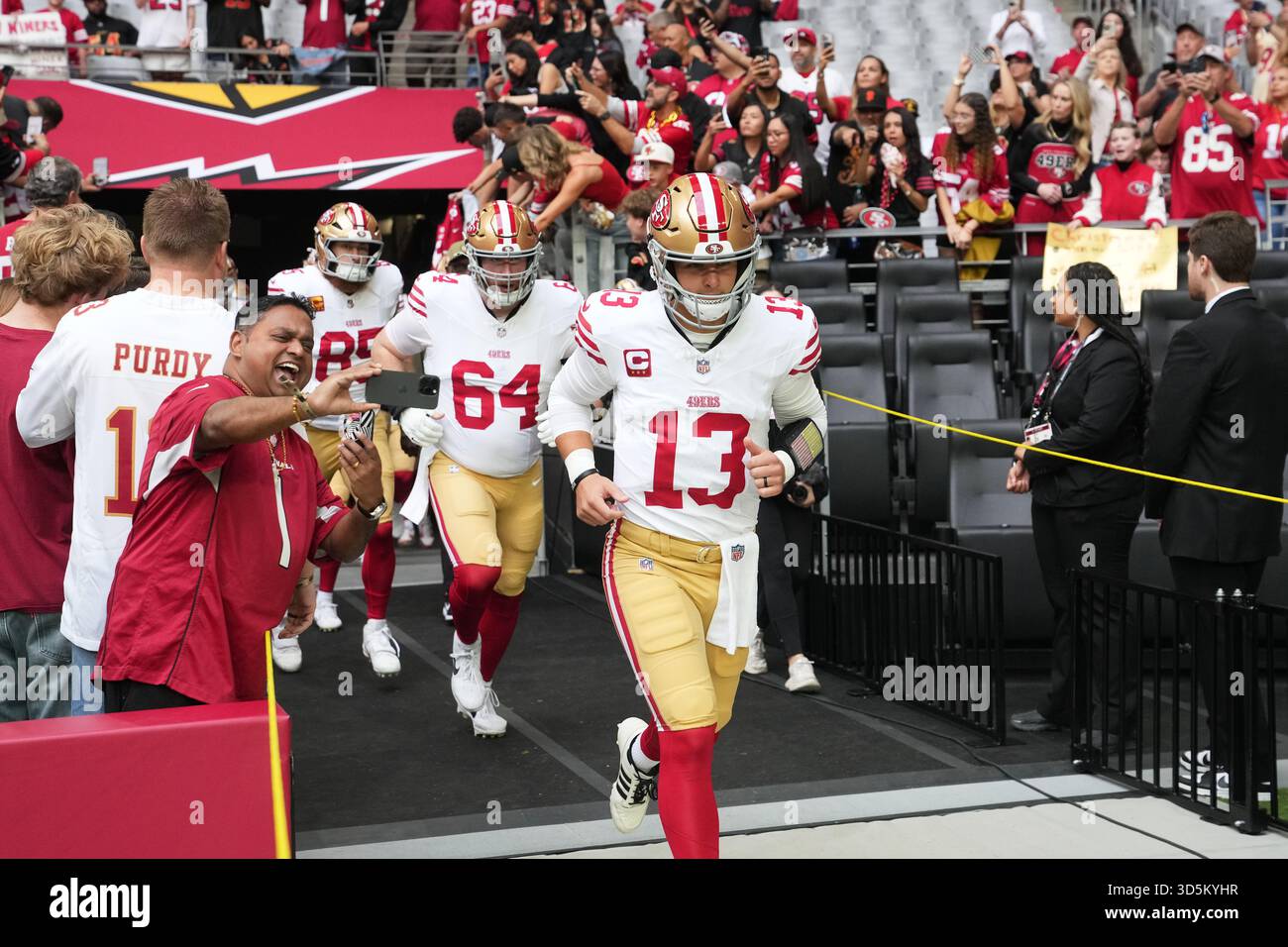 San Francisco 49ers quarterback Brock Purdy (13) and center Jake ...