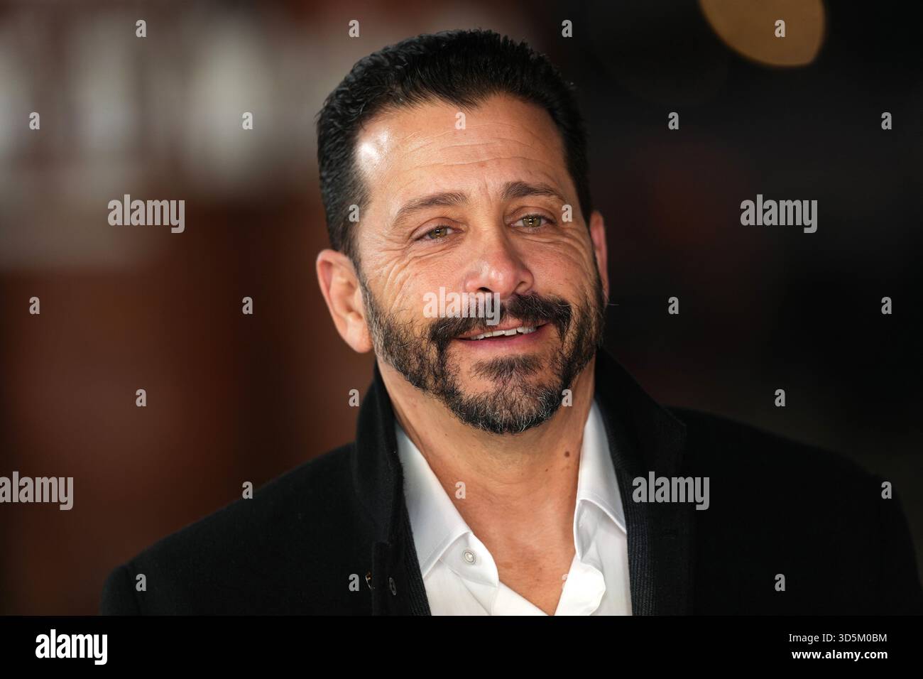 David Glasser poses for photographers upon arrival at the UK premiere ...