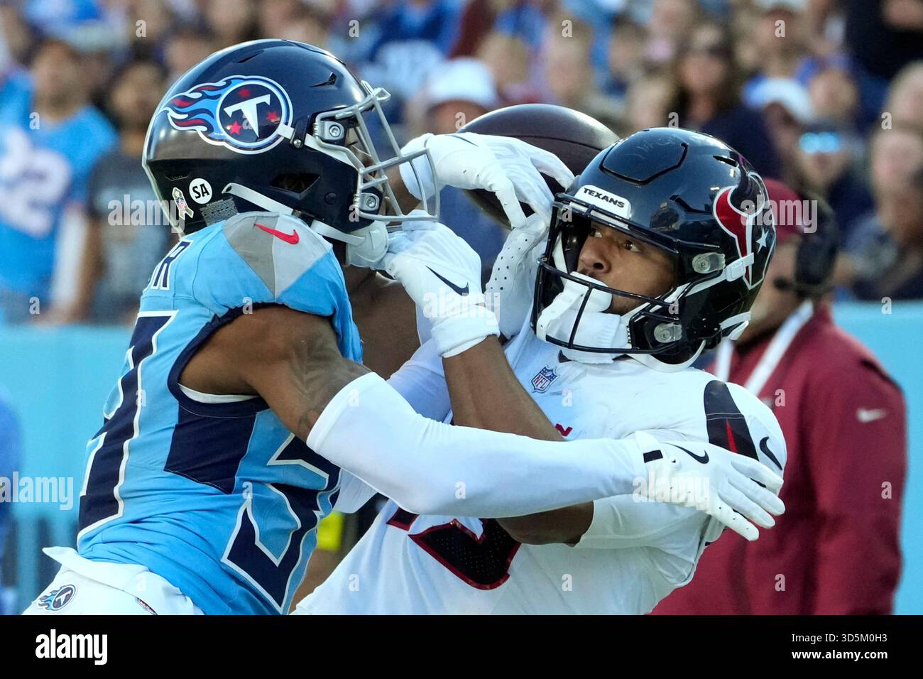 Tennessee Titans cornerback Darrell Baker Jr., left, breaks up a pass ...
