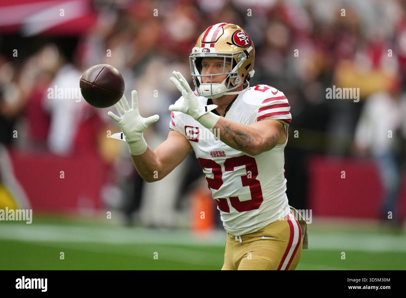 San Francisco 49ers running back Christian McCaffrey (23) warms up ...