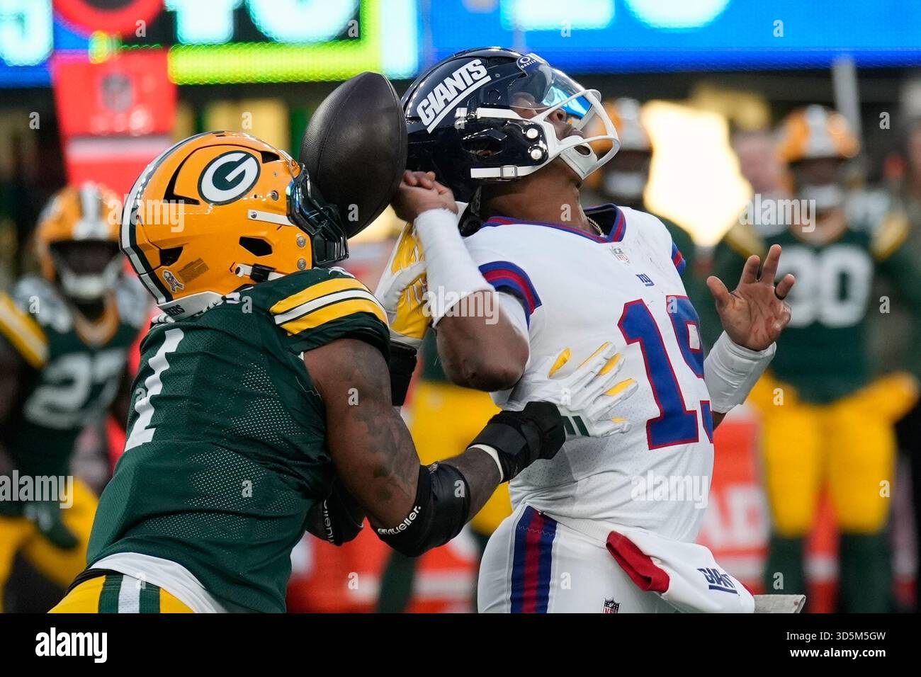 Green Bay Packers' Micah Parsons knocks the ball from New York Giants ...