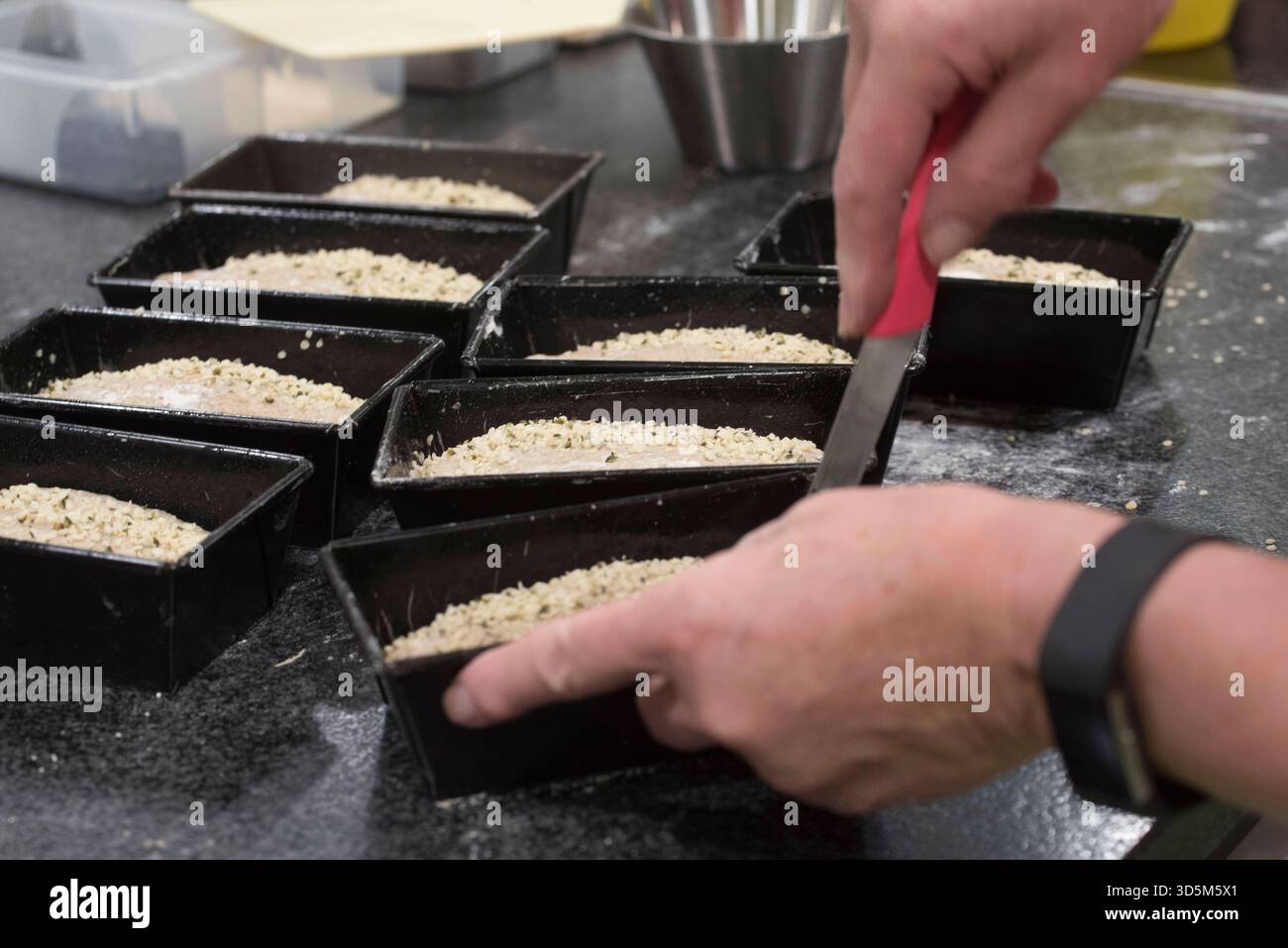 baking bread in the kitchen, with homemade bread dough baking bread in ...