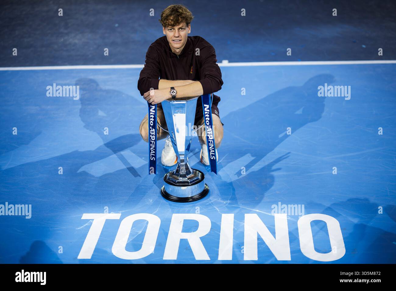 Jannik Sinner of Italy poses with the trophy at the end of his final ...